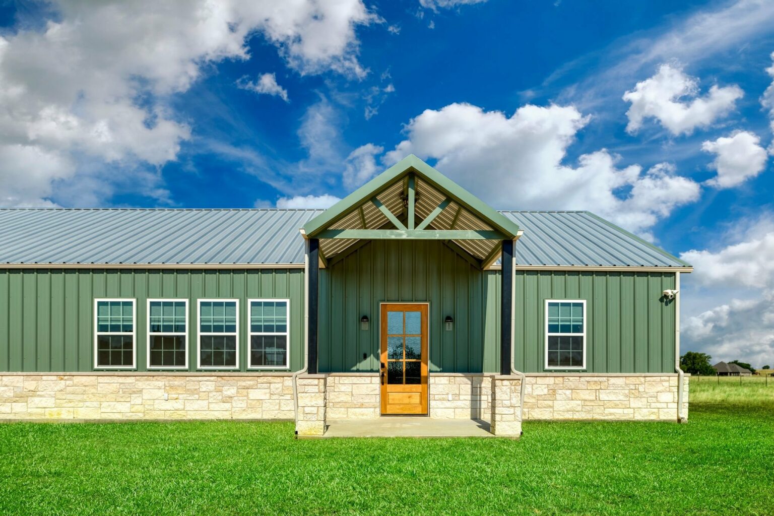 Vibrant Green Godley Texas Barndominium by HL Custom Homes