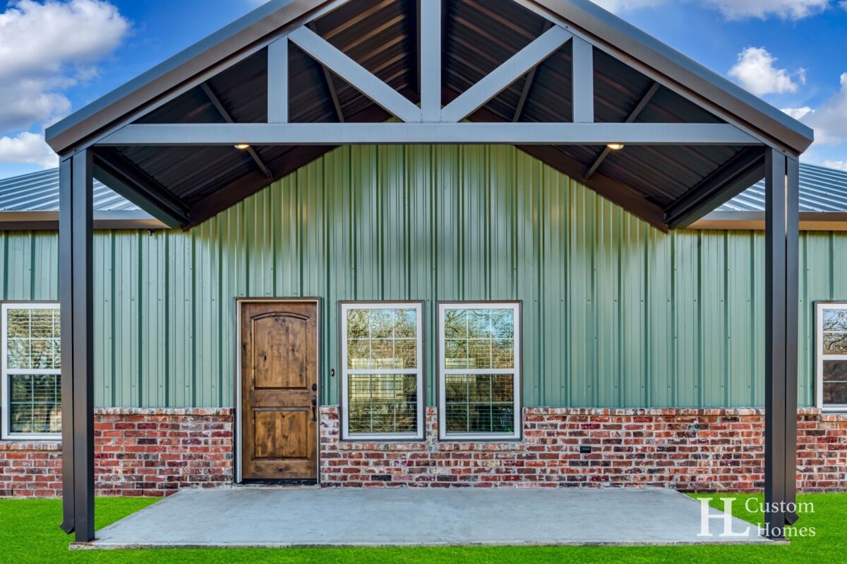 Green Barndominium with Carport by HL Custom Homes (Rolling Hills, TX)