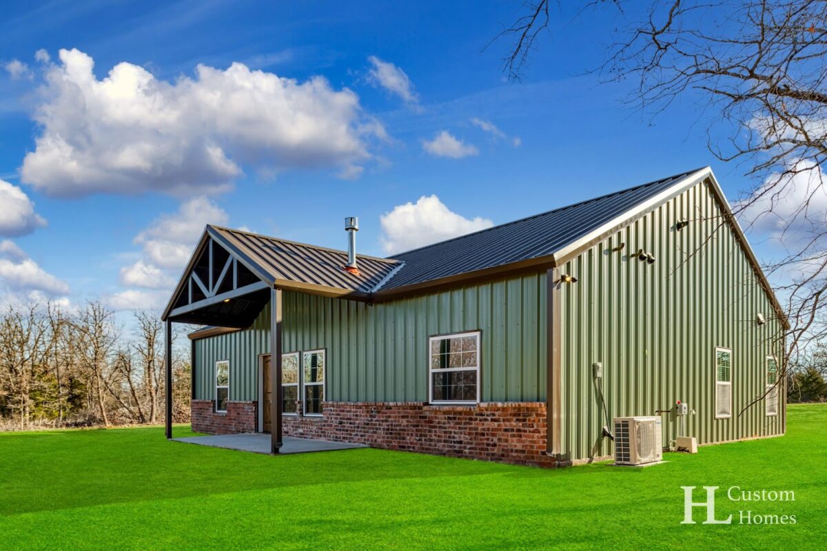 Green Barndominium with Carport by HL Custom Homes (Rolling Hills, TX)