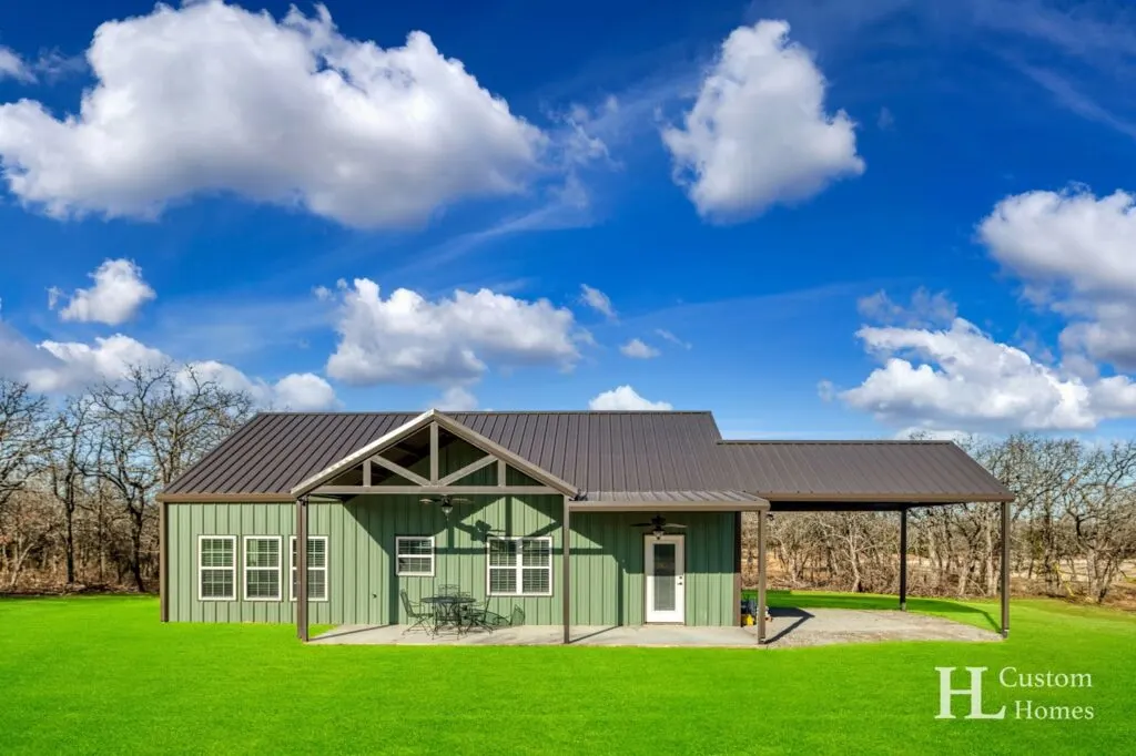 Green Barndominium with Carport by HL Custom Homes (Rolling Hills, TX)