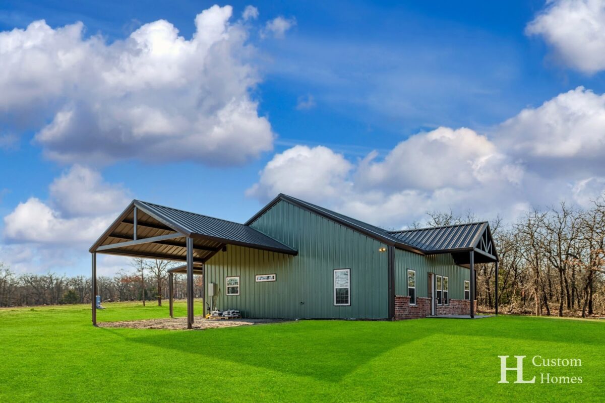Green Barndominium with Carport by HL Custom Homes (Rolling Hills, TX)