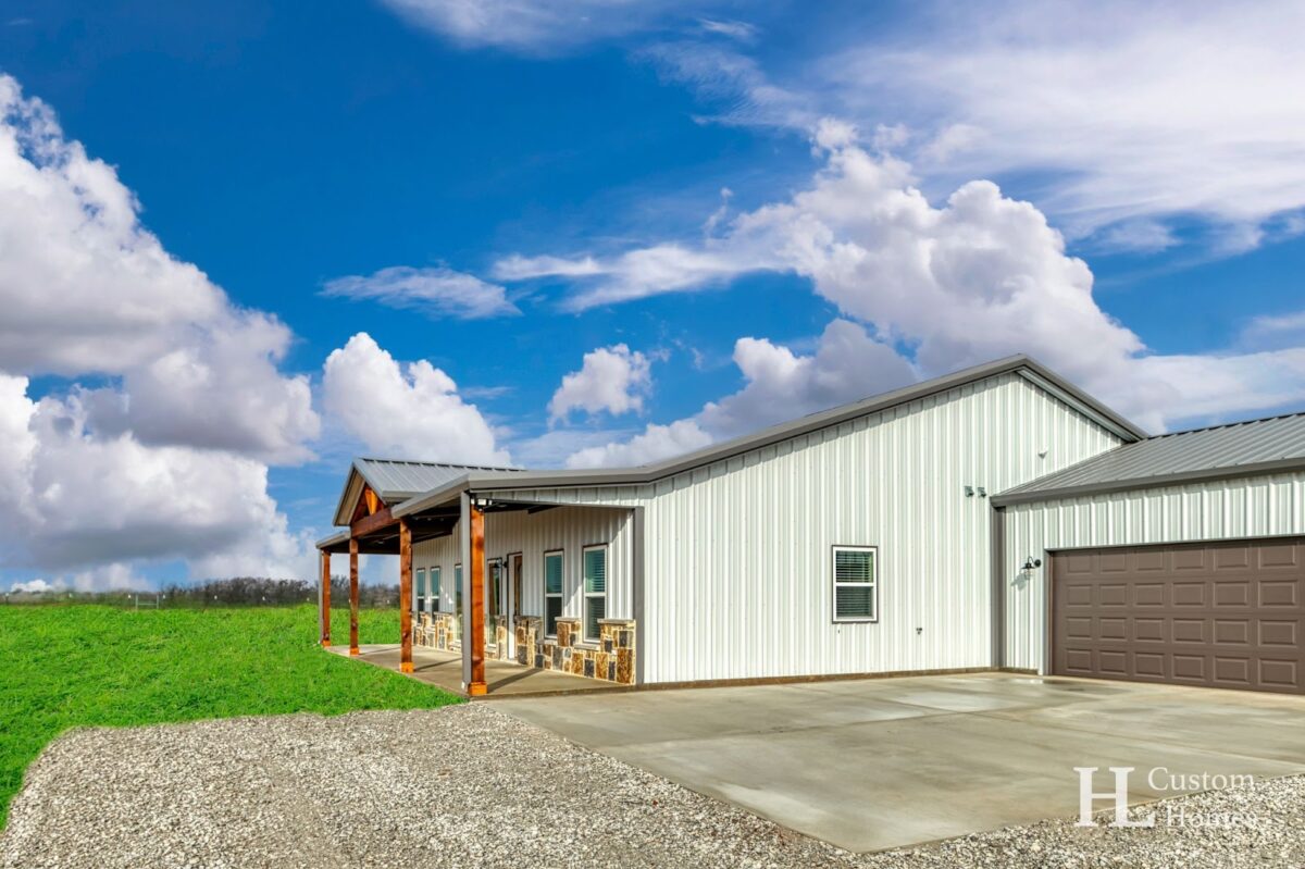 Whitt Metal Home With One Big Garage by HL Custom Homes