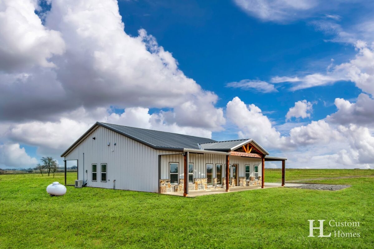 Whitt Metal Home With One Big Garage by HL Custom Homes