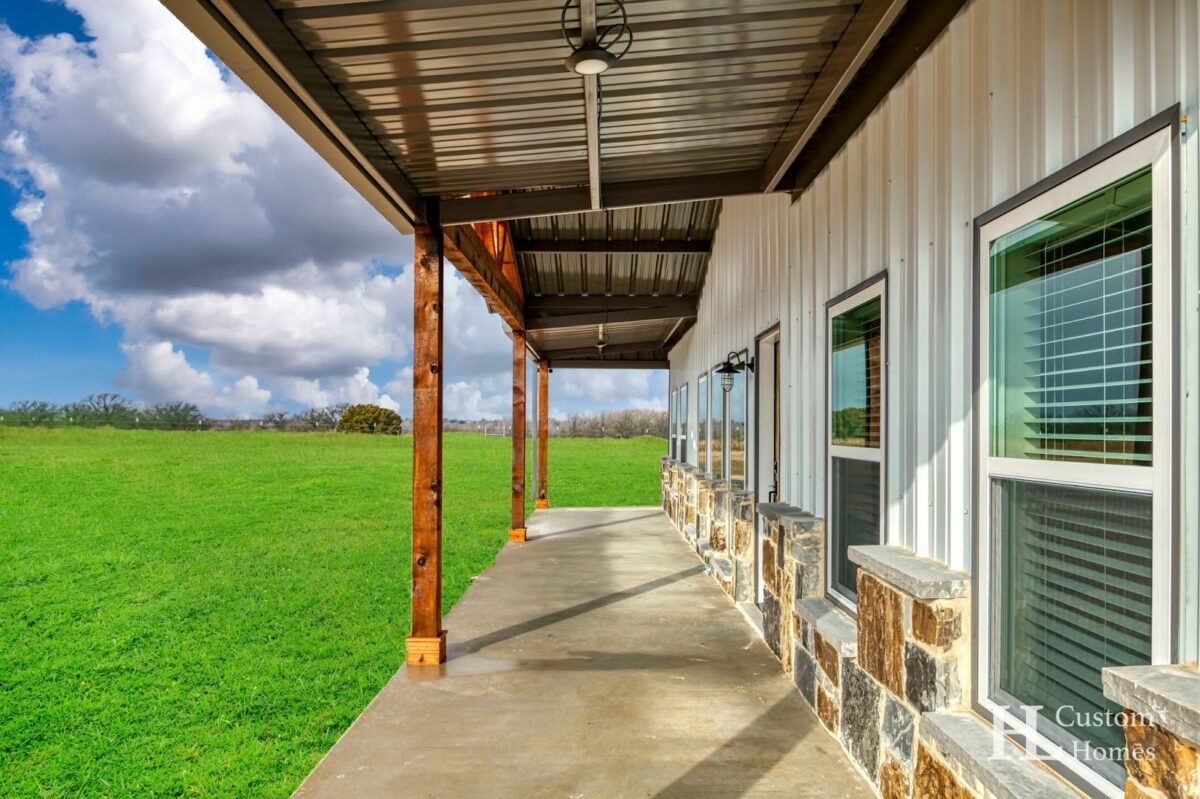 Whitt Metal Home With One Big Garage by HL Custom Homes