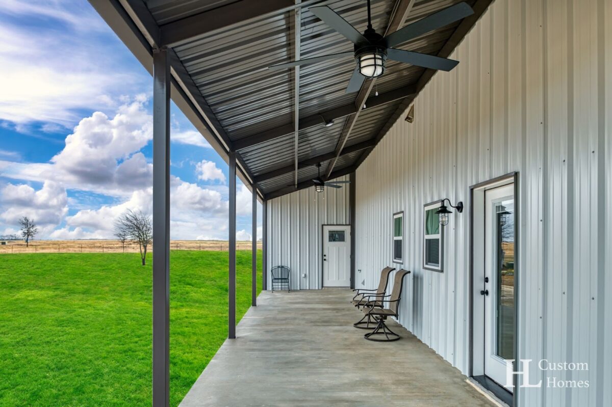 Whitt Metal Home With One Big Garage by HL Custom Homes