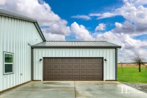 Whitt Metal Home With One Big Garage by HL Custom Homes